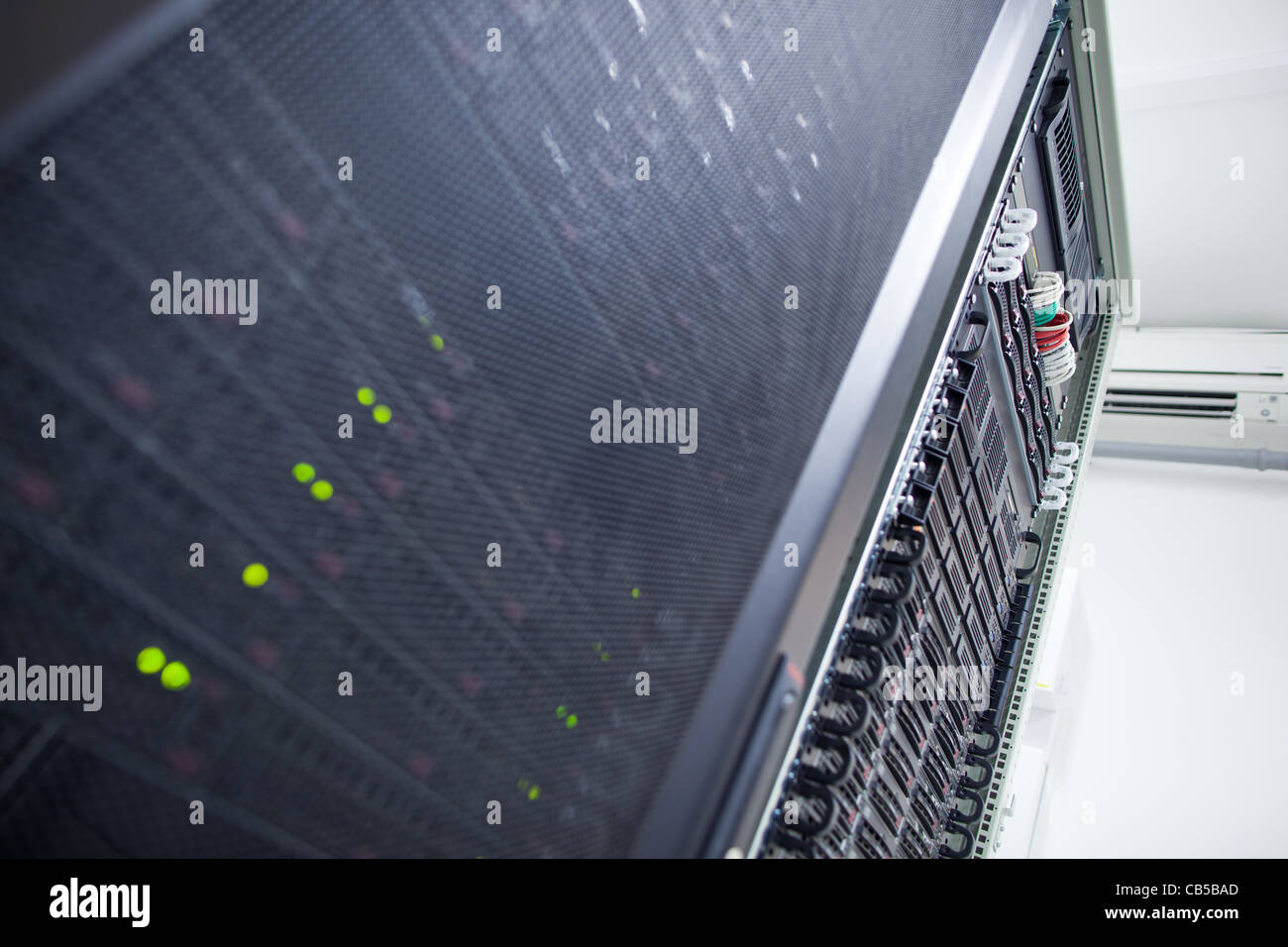 Server rack cluster in a data center (shallow DOF; color toned image ...