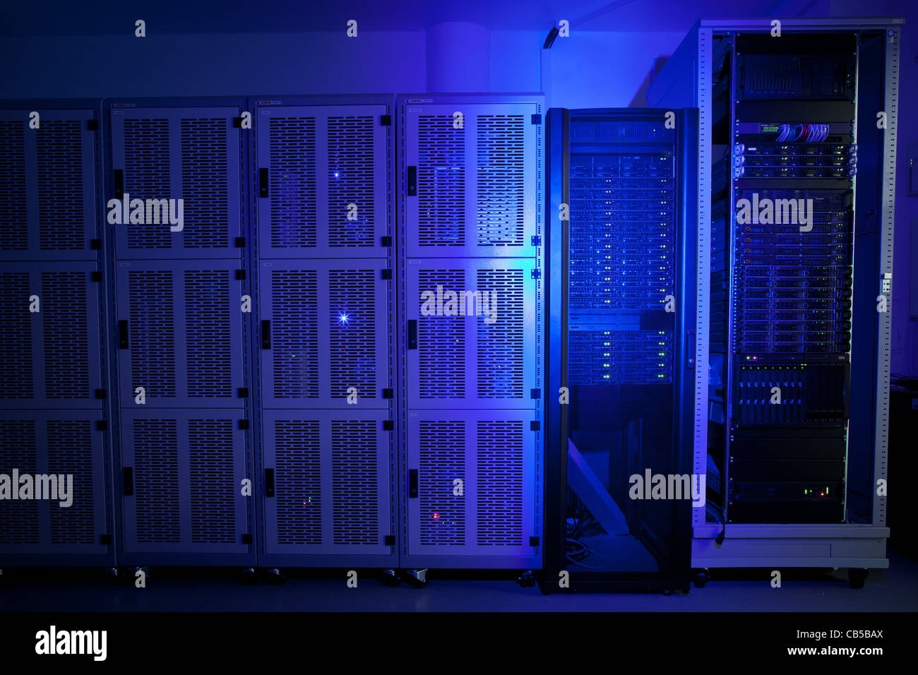 Server rack cluster in a data center (shallow DOF; color toned image ...