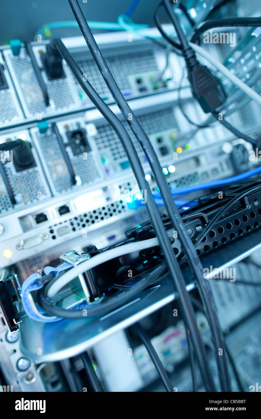 Server rack cluster in a data center (shallow DOF; color toned image ...