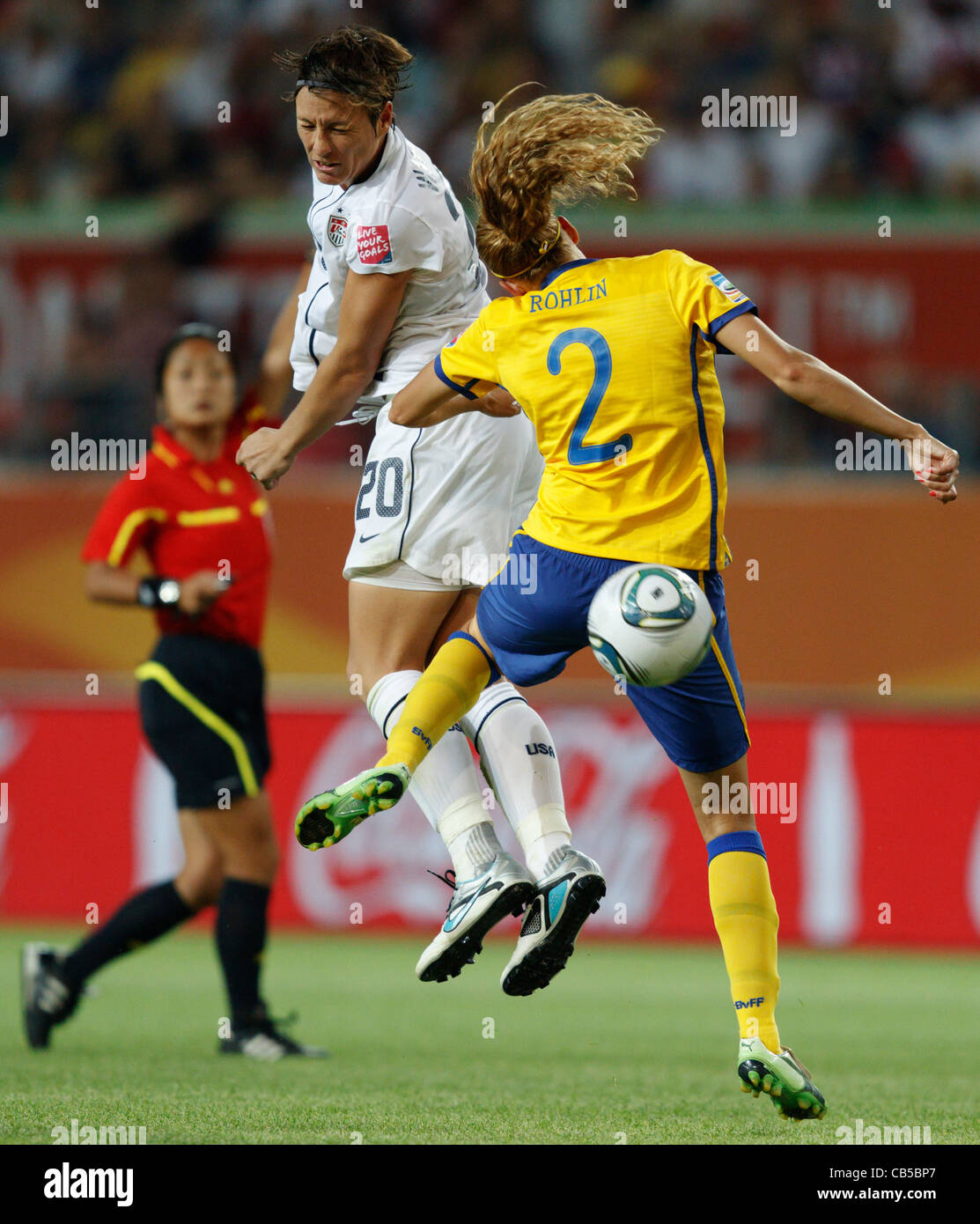 Abby Wambach of the USA (L) and Charlotte Rohlin of Sweden (R) battle ...