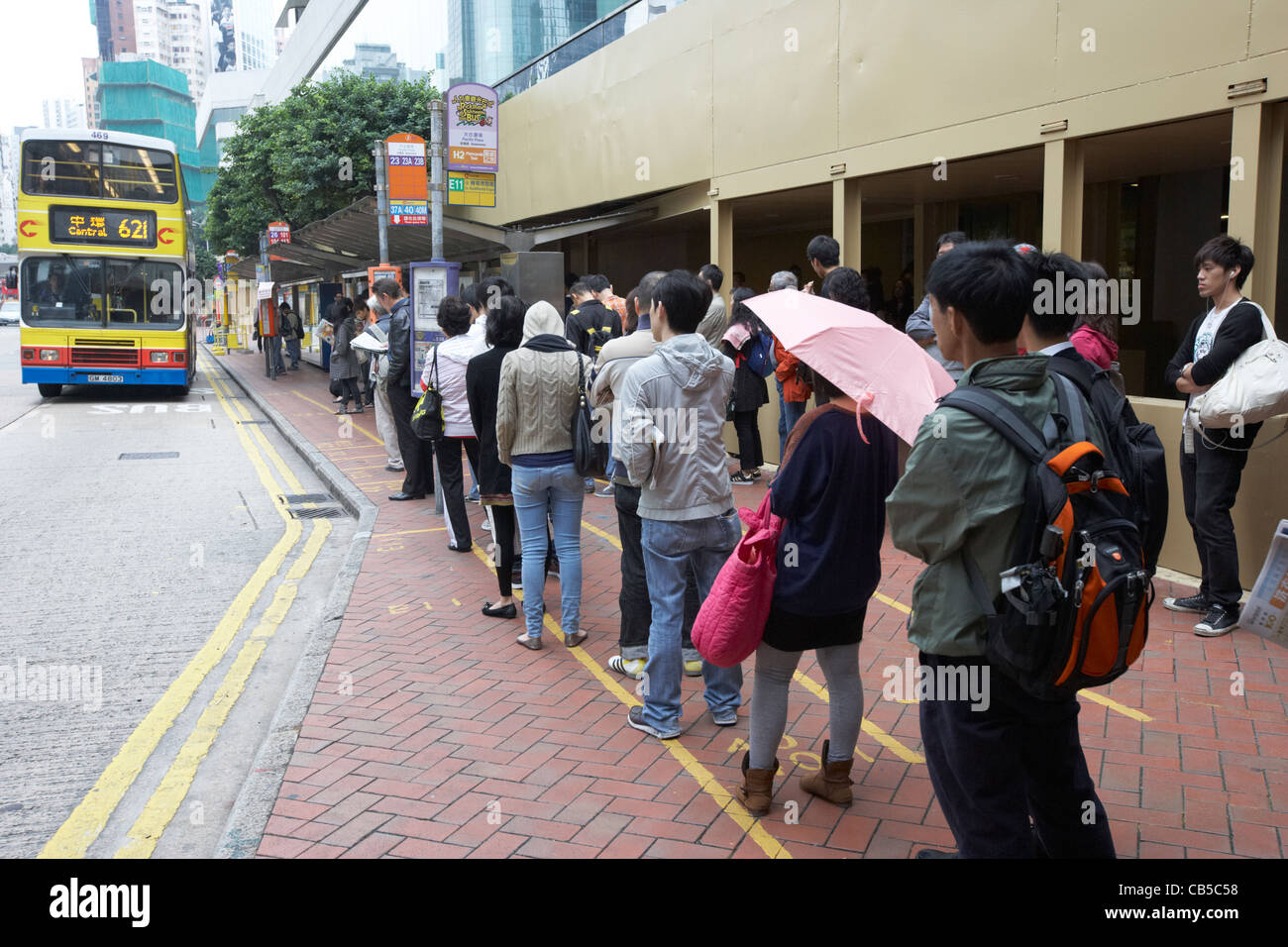 chinese people queueing for a bus in downtown admiralty district hong ...