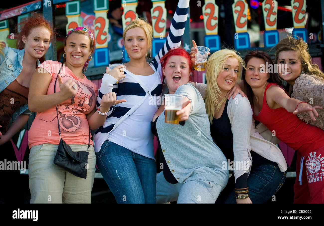 Group of young girls at fairground Stock Photo - Alamy