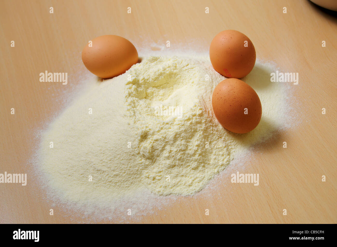 Making fresh pasta - flour and eggs - stage one Stock Photo - Alamy
