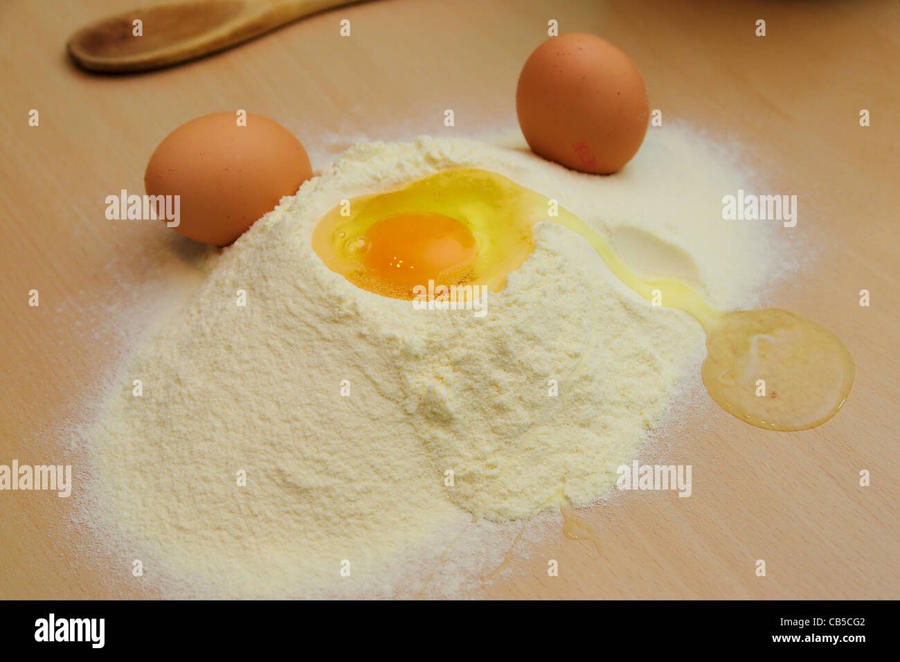 Making fresh pasta - flour and eggs - stage two Stock Photo - Alamy