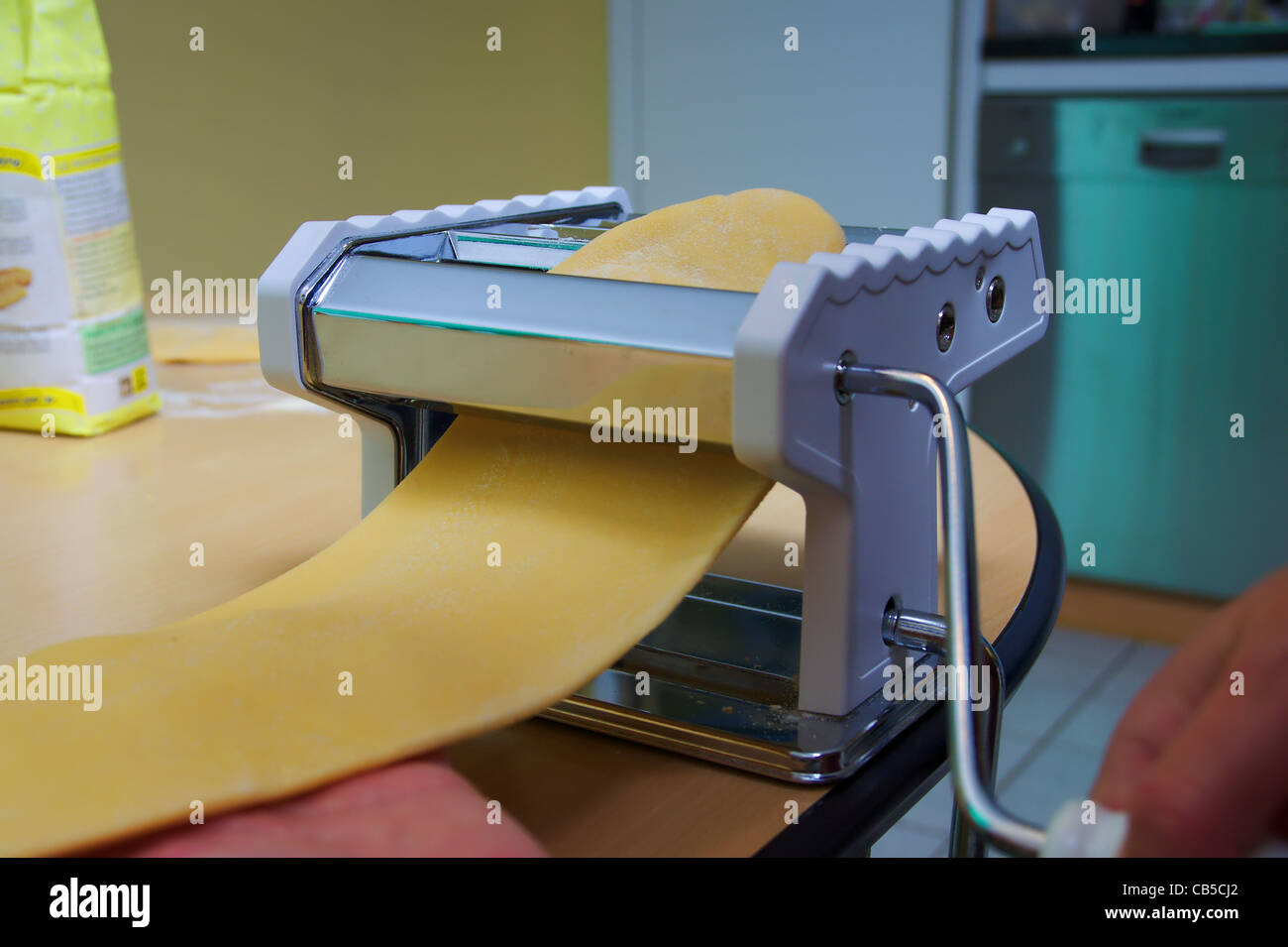 Making fresh pasta - flour and eggs - rolling Stock Photo - Alamy