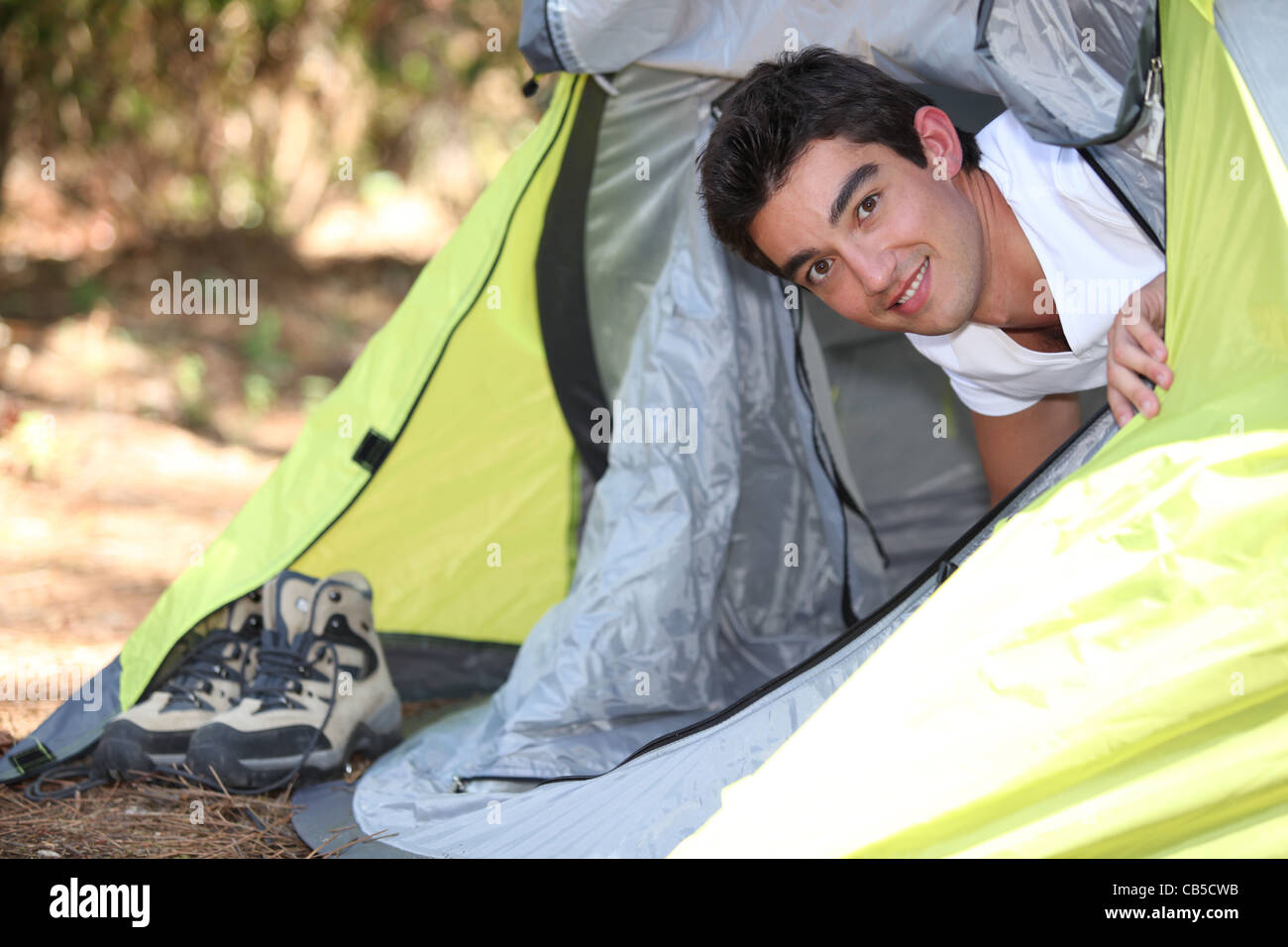 young man camping Stock Photo - Alamy