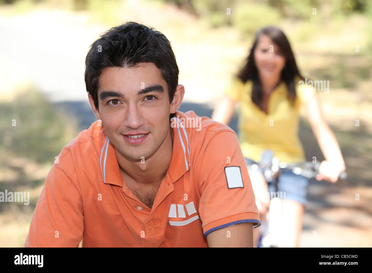 Boy and girl having a bike ride Stock Photo - Alamy