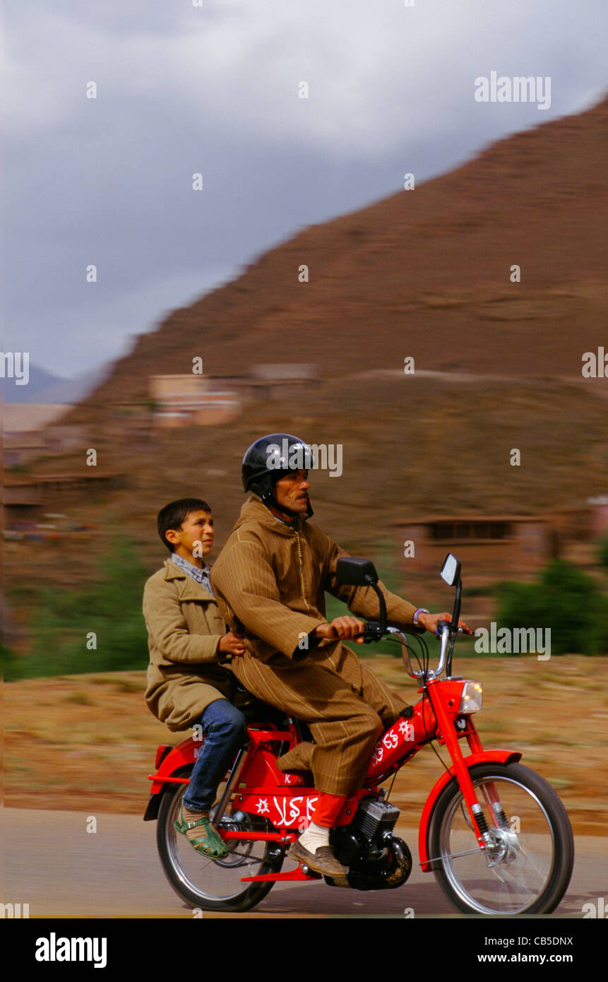 A man rides a motorbike he has won in a competition sponsored by Coca ...