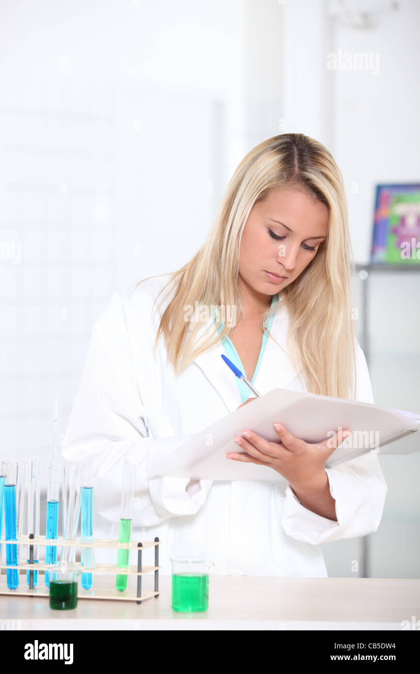 Blond woman in science laboratory Stock Photo - Alamy
