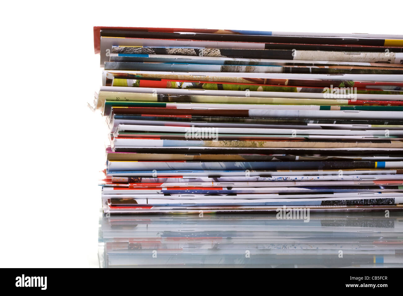 Stack of magazines isolated on white with reflection Stock Photo - Alamy