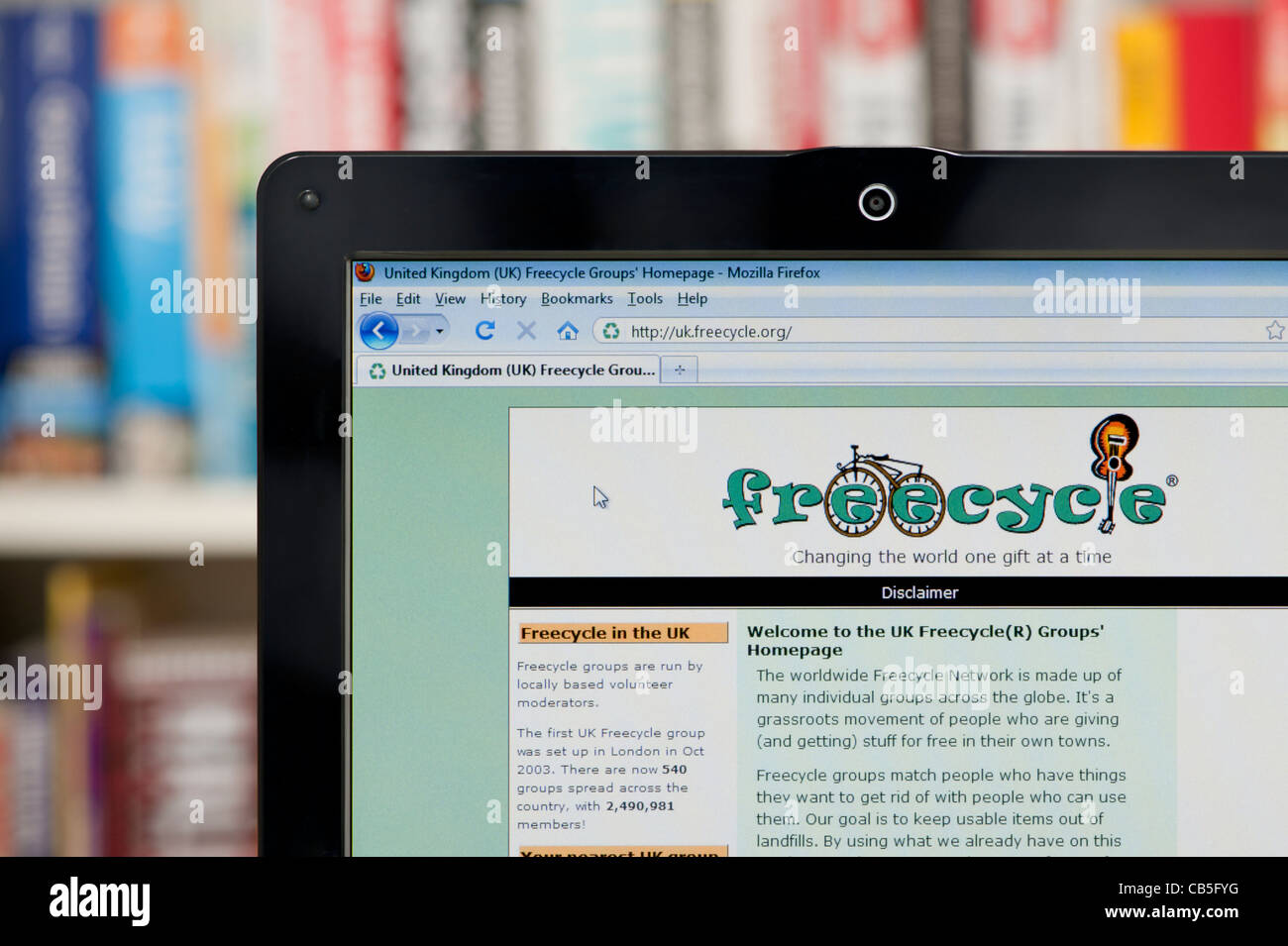 The Freecycle website shot against a bookcase background (Editorial use ...