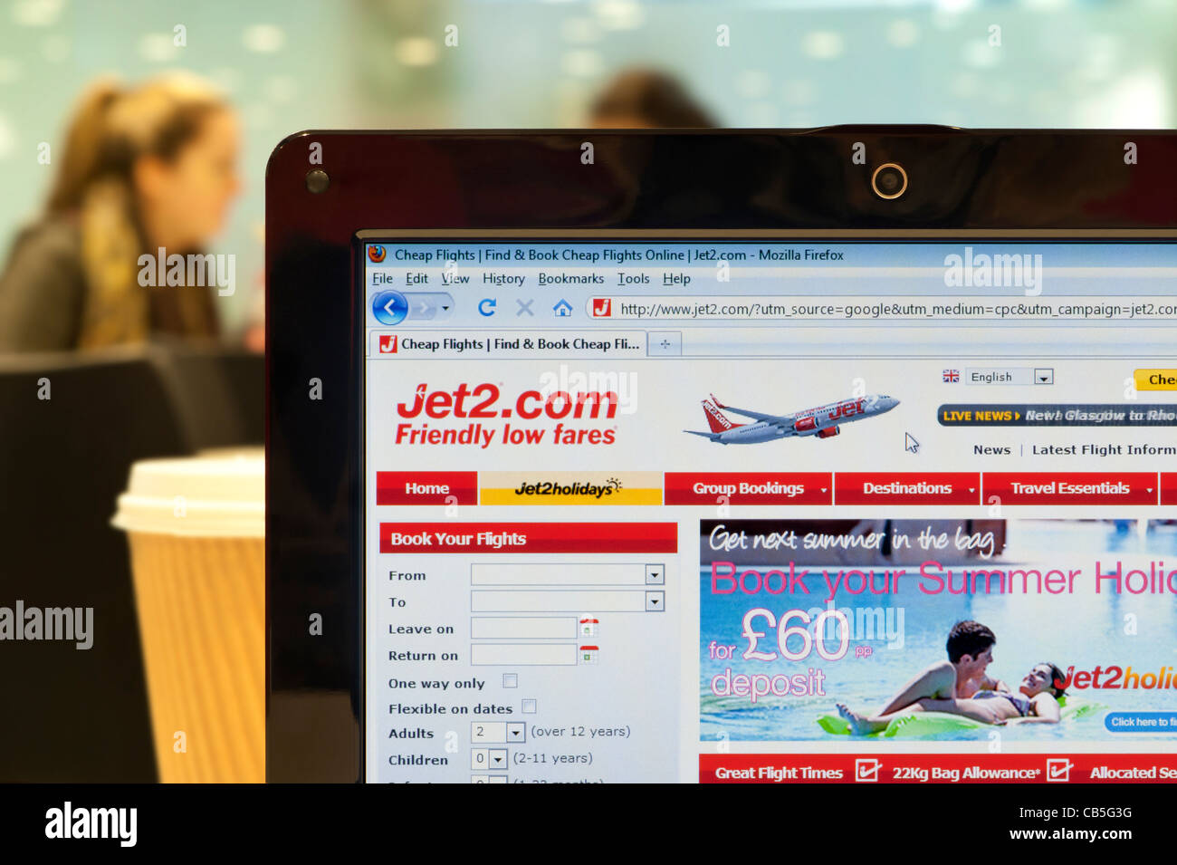 The Jet2.com website shot in a coffee shop environment (Editorial use ...