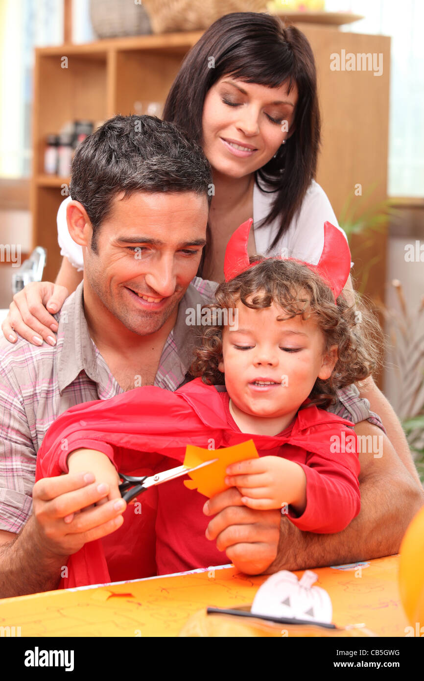 parents and child preparing for Halloween Stock Photo - Alamy