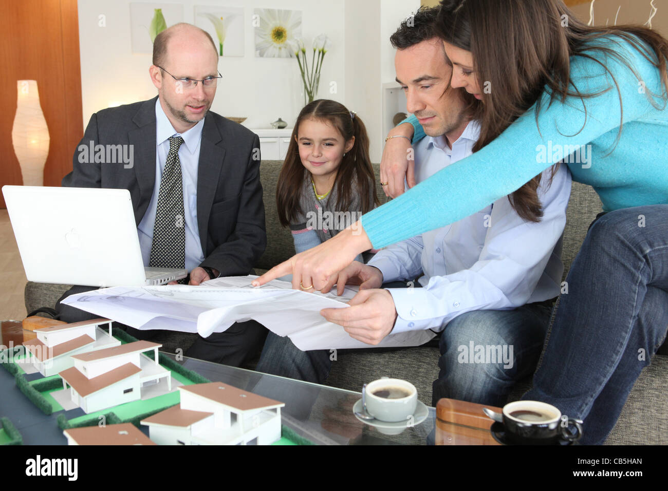 Family with realtor Stock Photo - Alamy