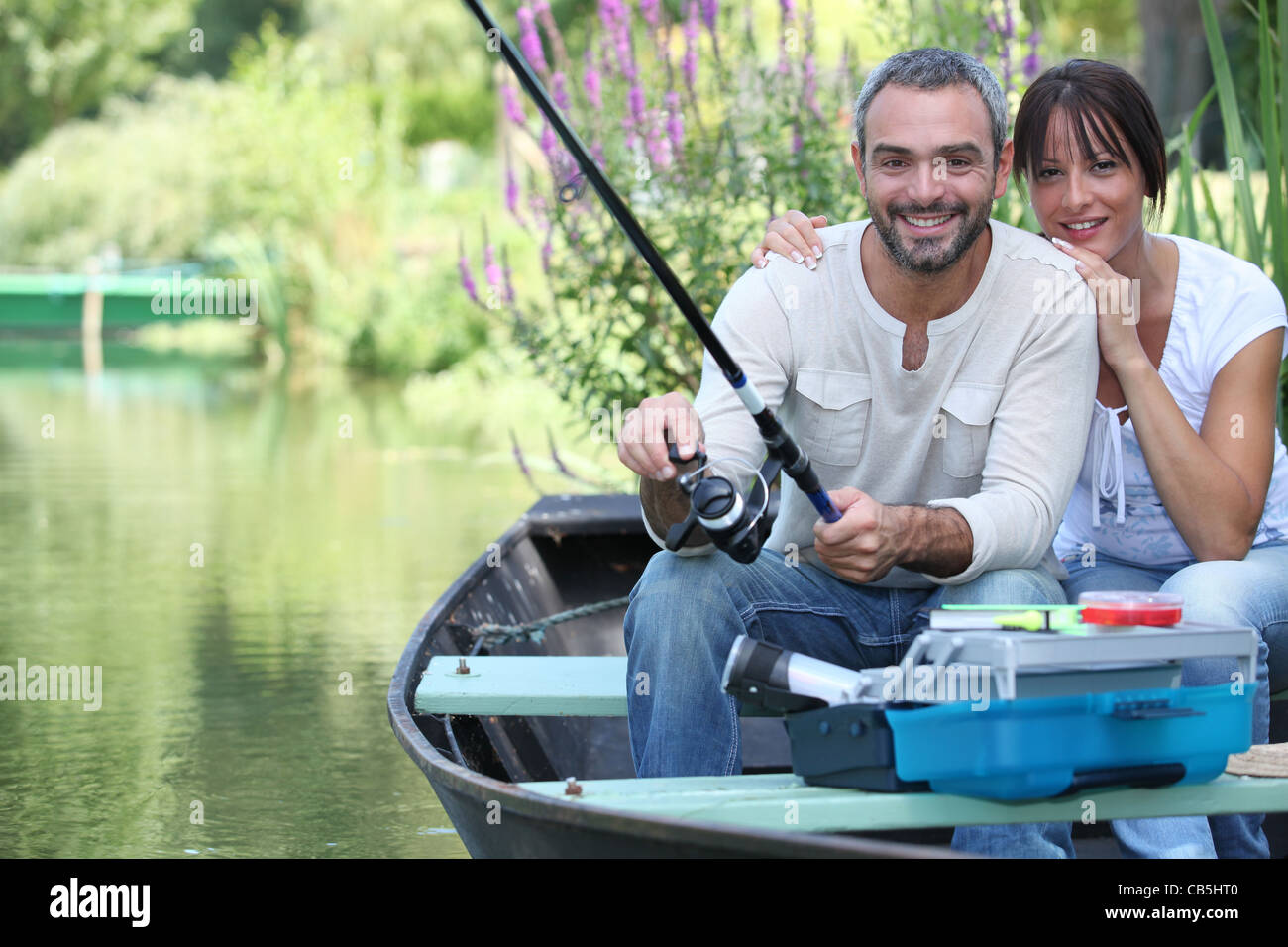 sitting boat fishing Stock Photo - Alamy
