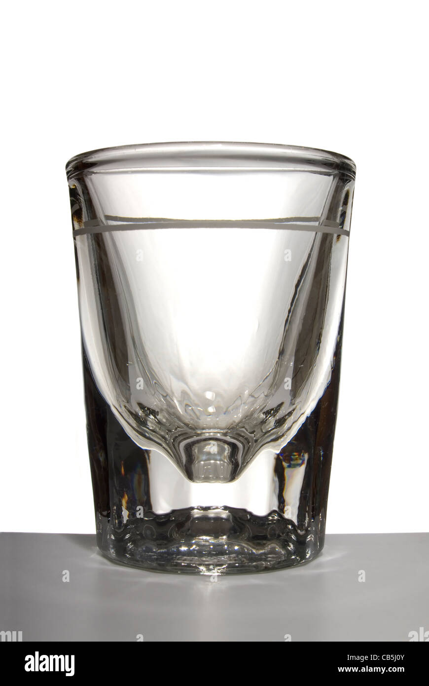 Empty crystal shot glass Stock Photo - Alamy
