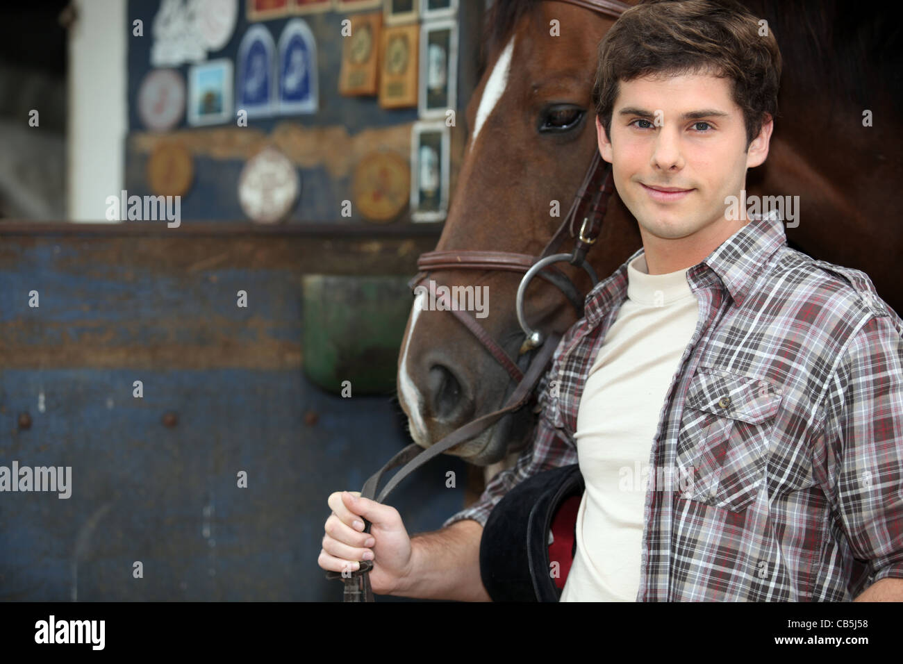Young man with horse Stock Photo - Alamy