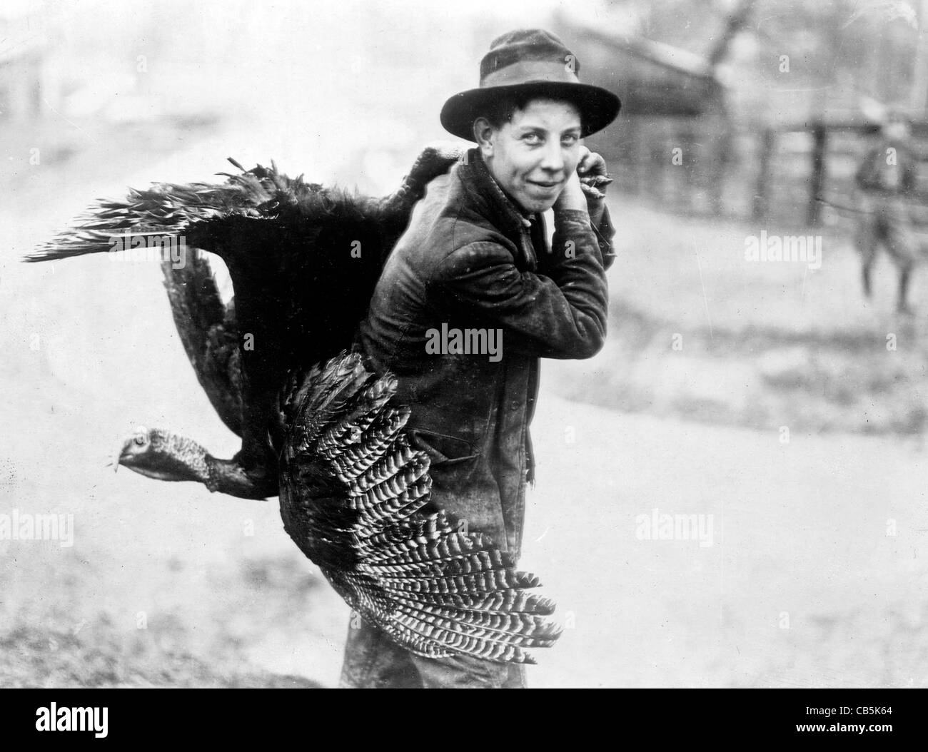 Thanksgiving turkey - Young Man with Turkey on Thanksgiving Day, circa ...