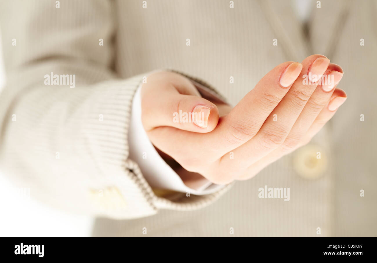 Image of human hand keeping palm up on background of female Stock Photo ...