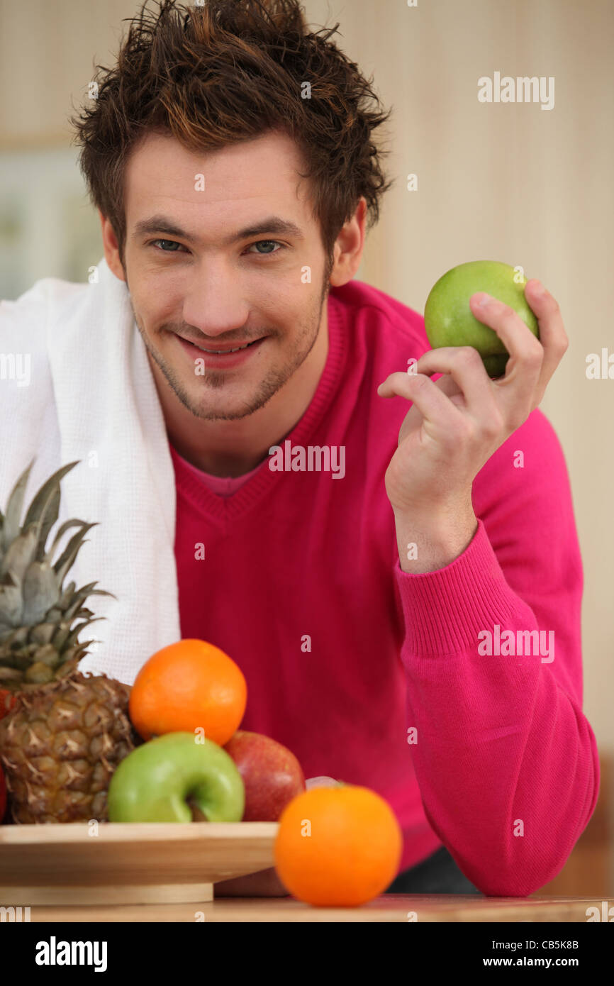 young man and fruits Stock Photo - Alamy