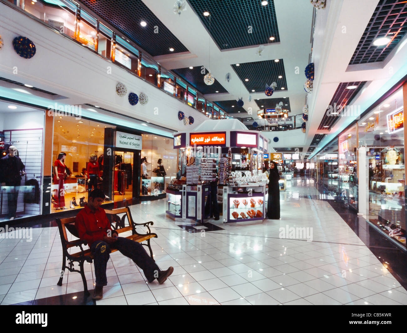 Dubai UAE Dubai Airport Duty Free Man Sitting On Bench Stock Photo - Alamy