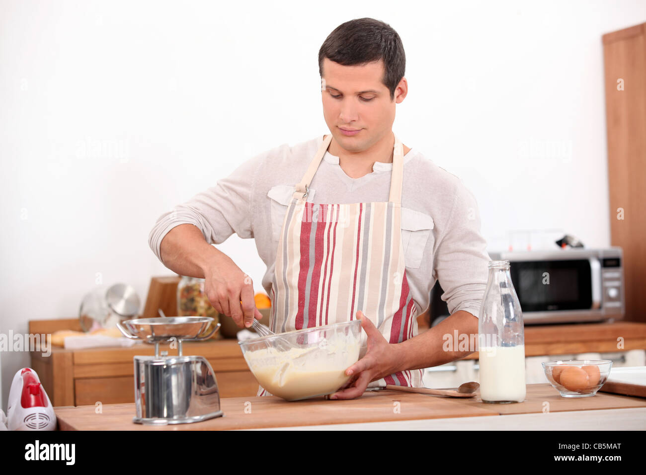 Man stirring mixture in bowl Stock Photo - Alamy