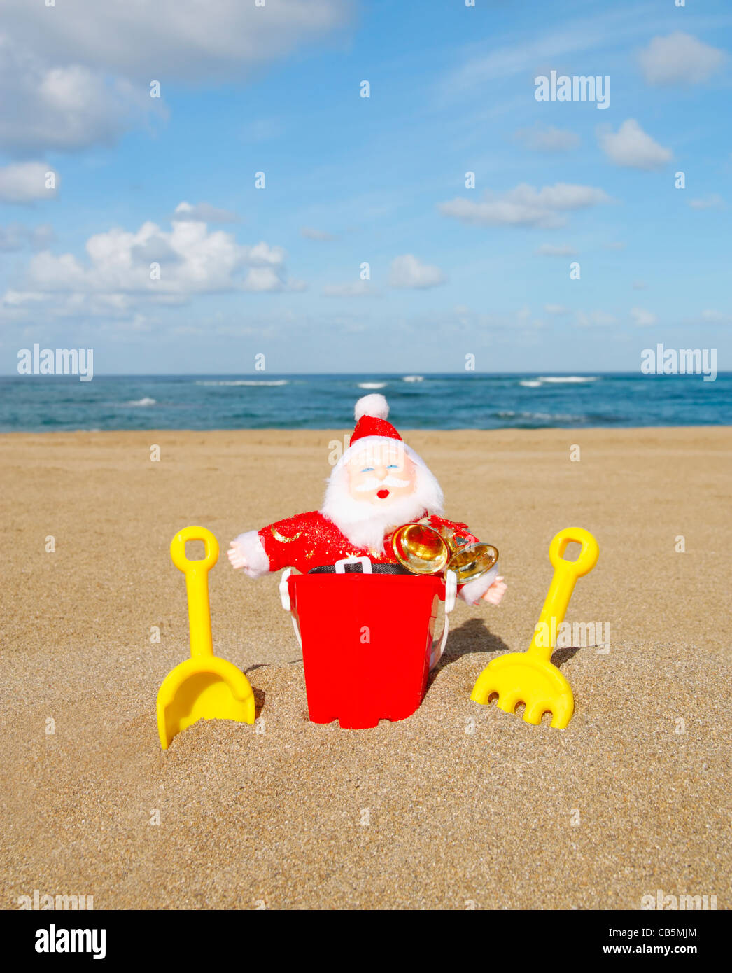 Santa and bucket and spade on beach in Spain Stock Photo - Alamy