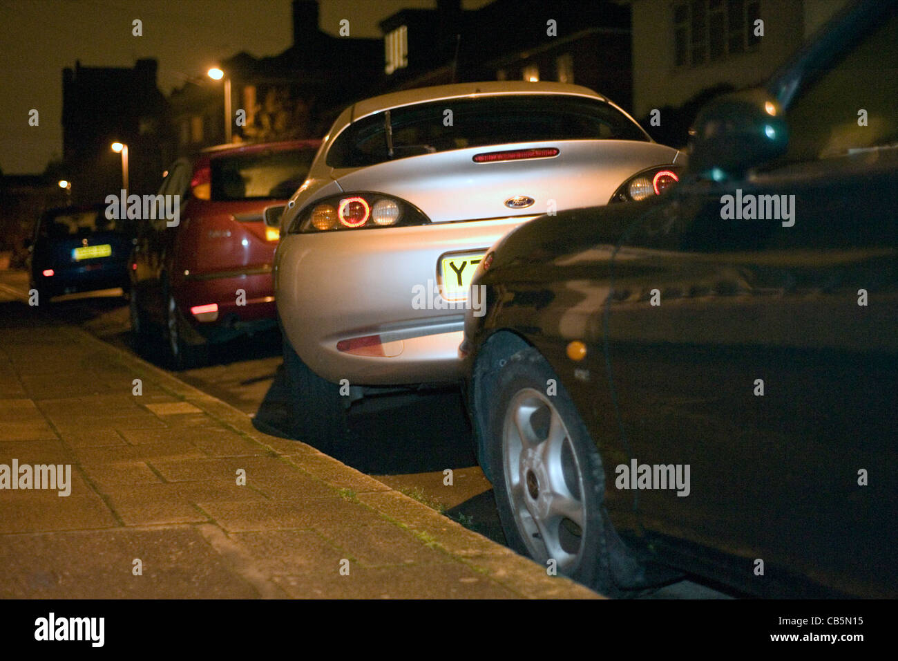 careless and dangerous car parking on an urban street at night Stock ...