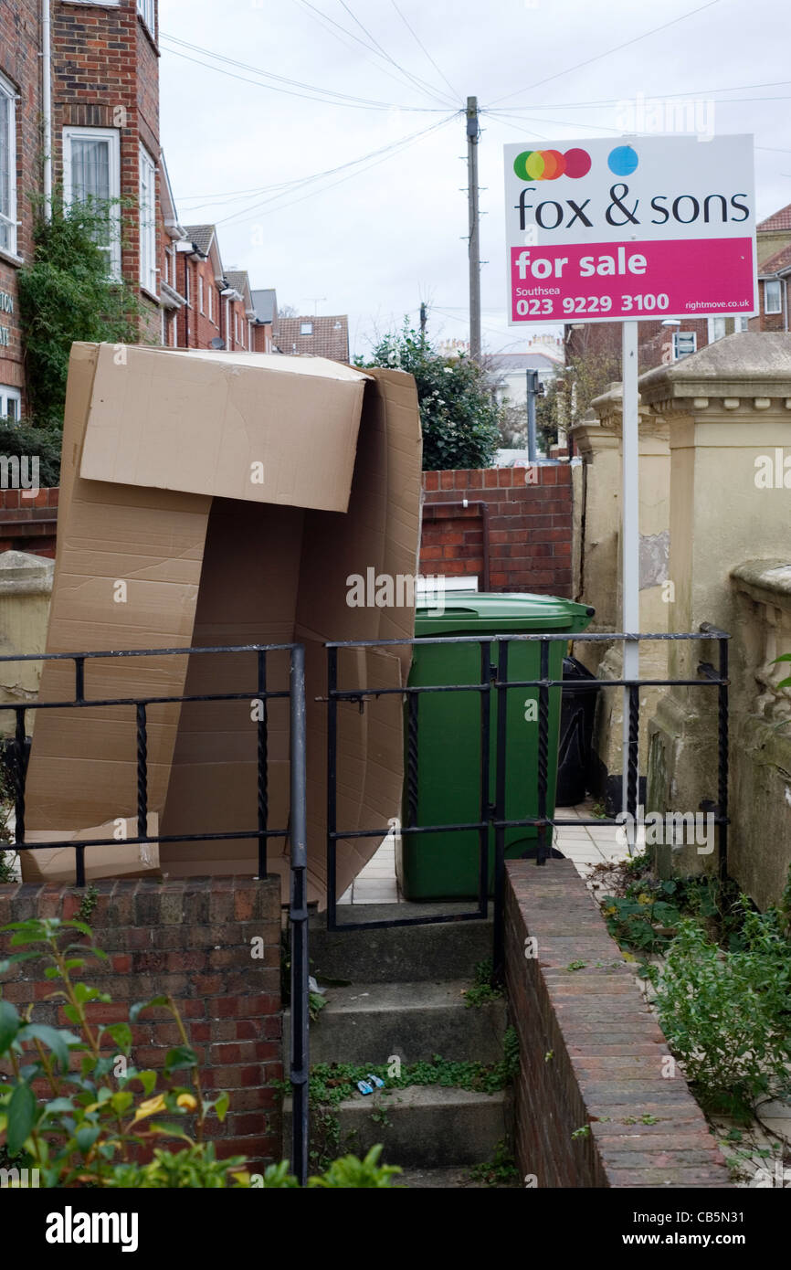 large cardboard moving box by recycle bin outside of apartment for sale ...