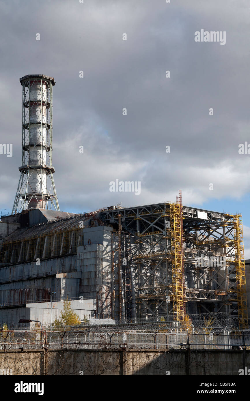 Reactor Number 4 at Chernobyl, encased in its old sarcophagus with the ...