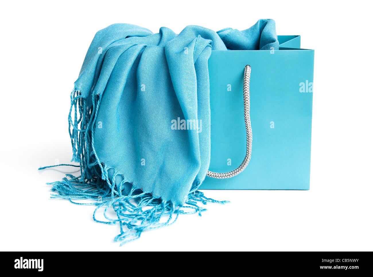 Blue scarf in shopping bag against white background Stock Photo - Alamy