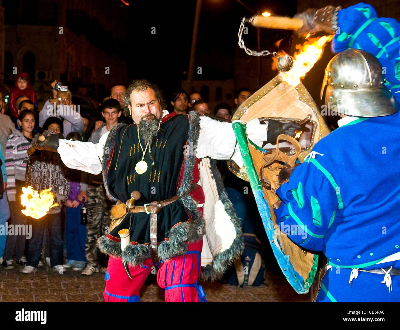 An Italian actors dresses as knight fight with sword and fire in the ...