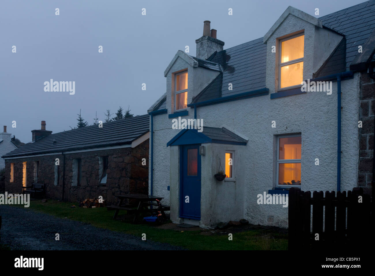 Rain swept cottage in remote bay at Kintra, Isle of Mull, Scotland ...