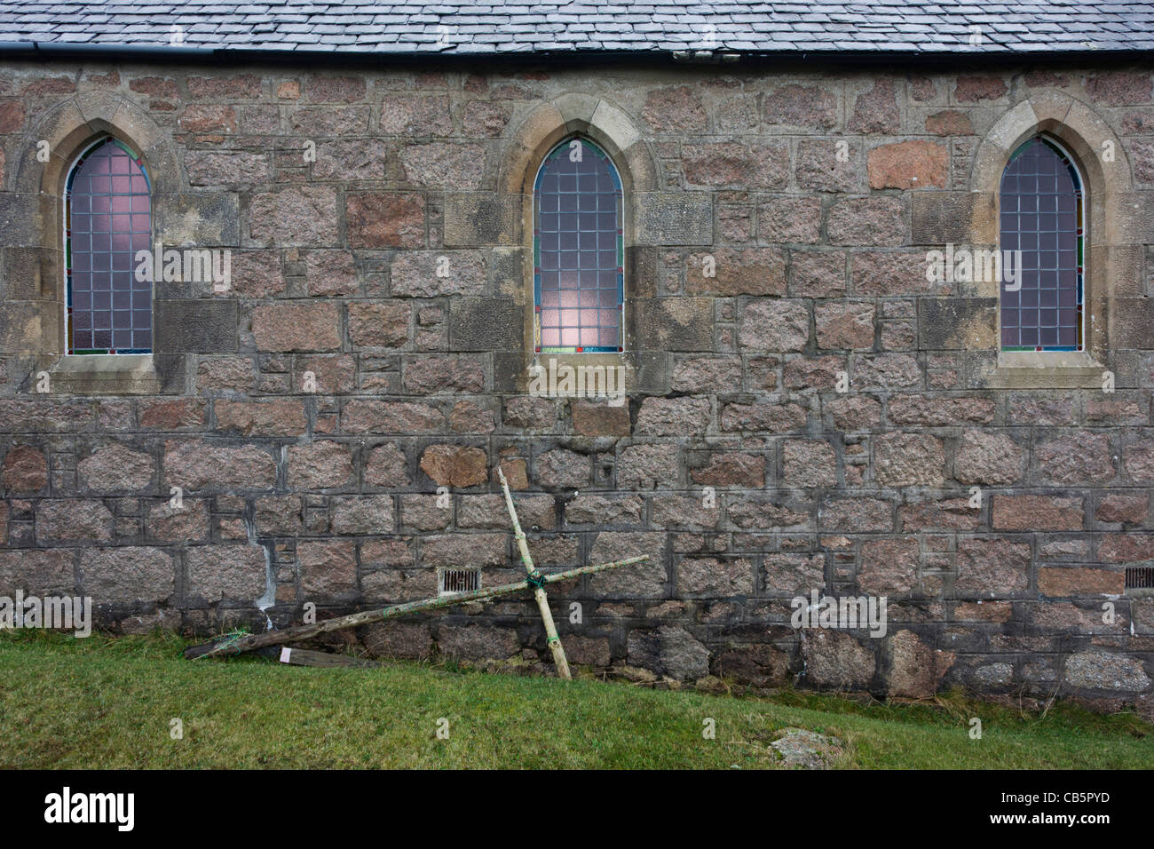 Crucifix cross prop leaning against outside wall of St Ernan's church ...