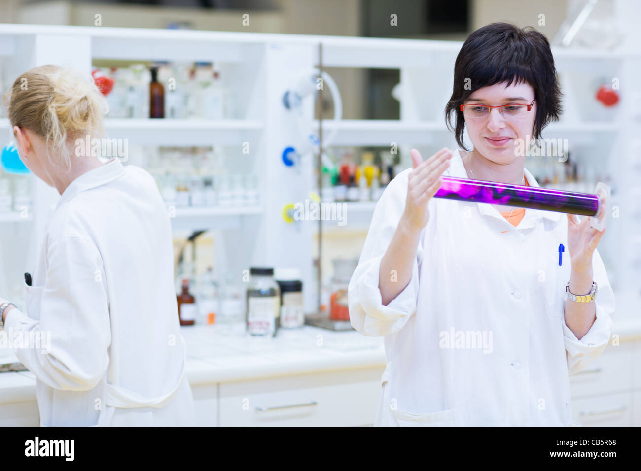 portrait of a female researcher carrying out research in a chemistry ...