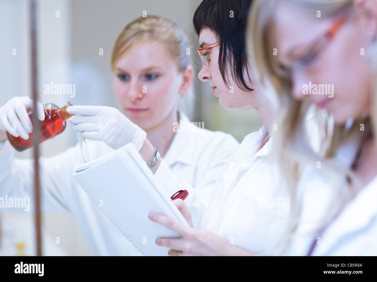 portrait of a female researcher carrying out research in a chemistry ...