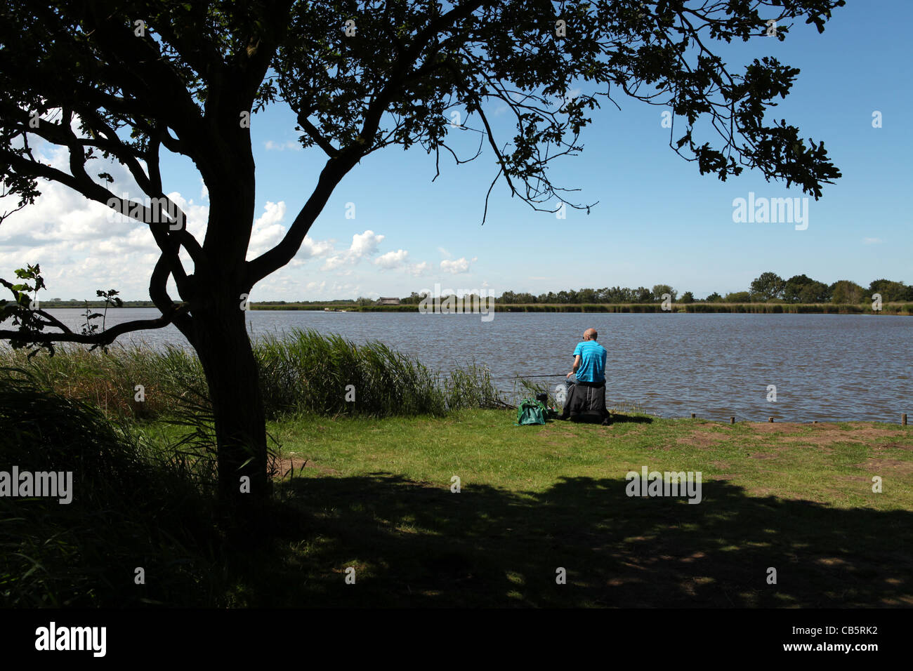 Fisherman by Horsey Mere on the Norfolk Broads, England Stock Photo - Alamy