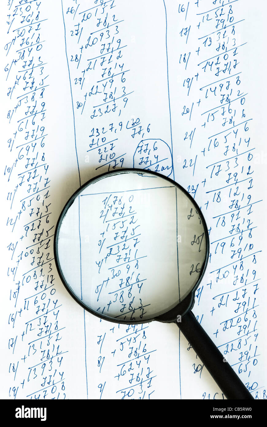 papers and magnifying glass, focus point on center of photo Stock Photo ...