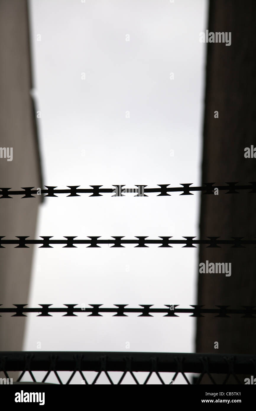 Barb Wire Over gate Stock Photo - Alamy