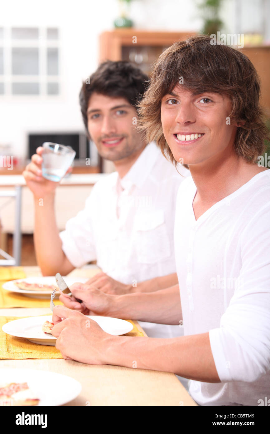 two friends having dinner Stock Photo - Alamy