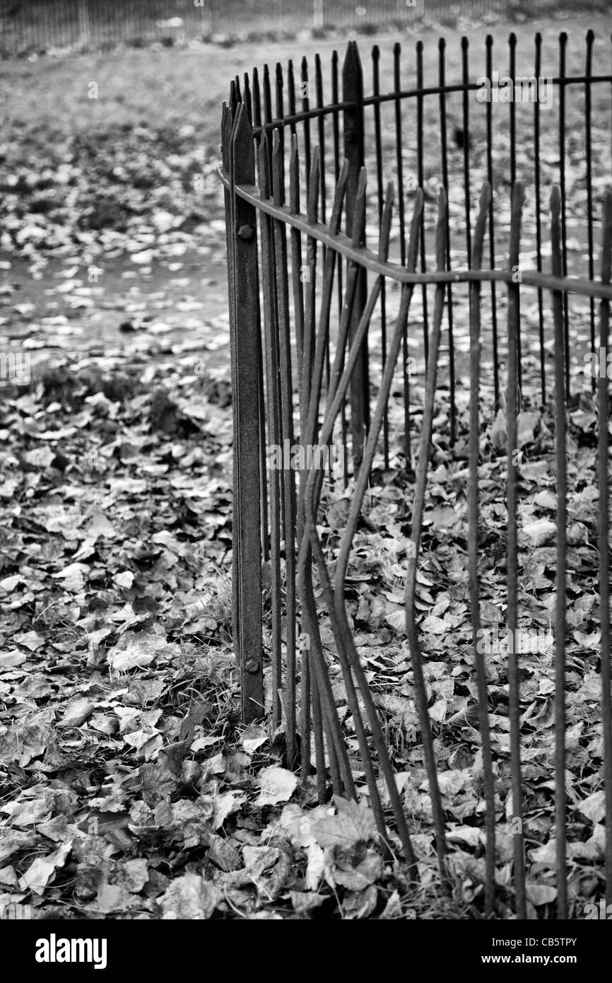 Round Fence with bars bent - BW Stock Photo - Alamy