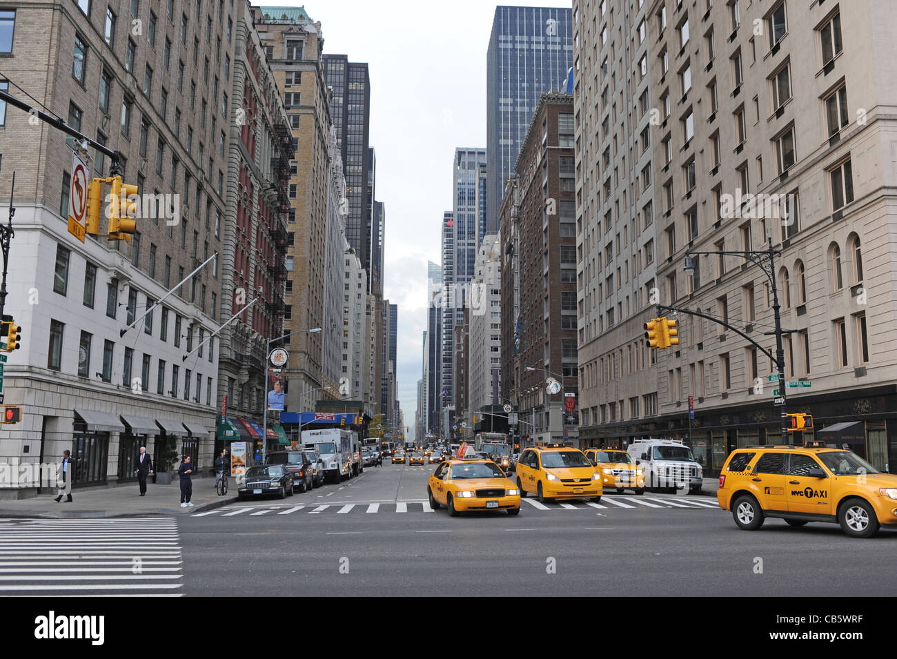Yellow taxi cabs driving through Midtown Manhattan New York NYC USA ...