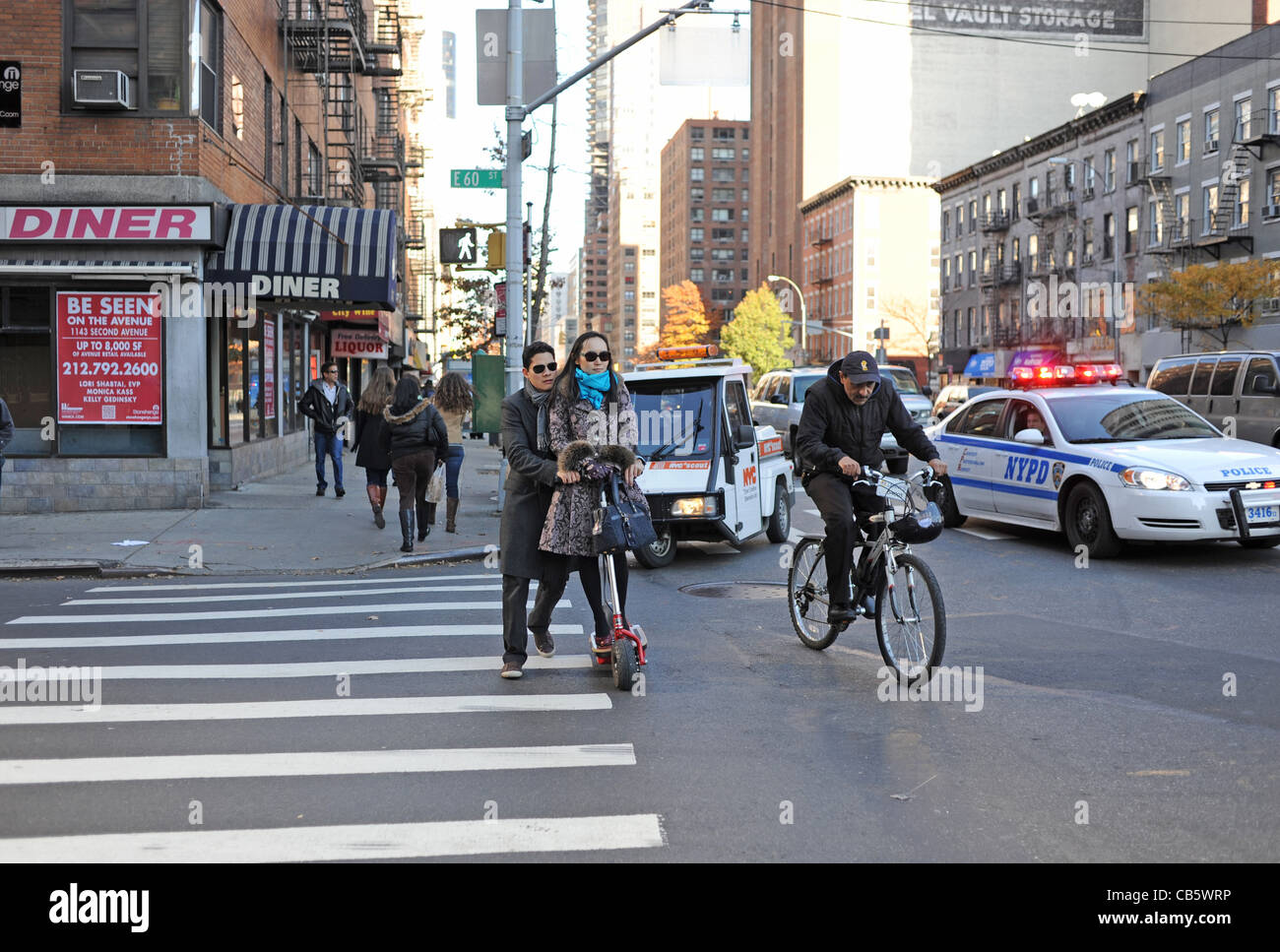 Crossing scooter traffic people commuting hi-res stock photography and ...