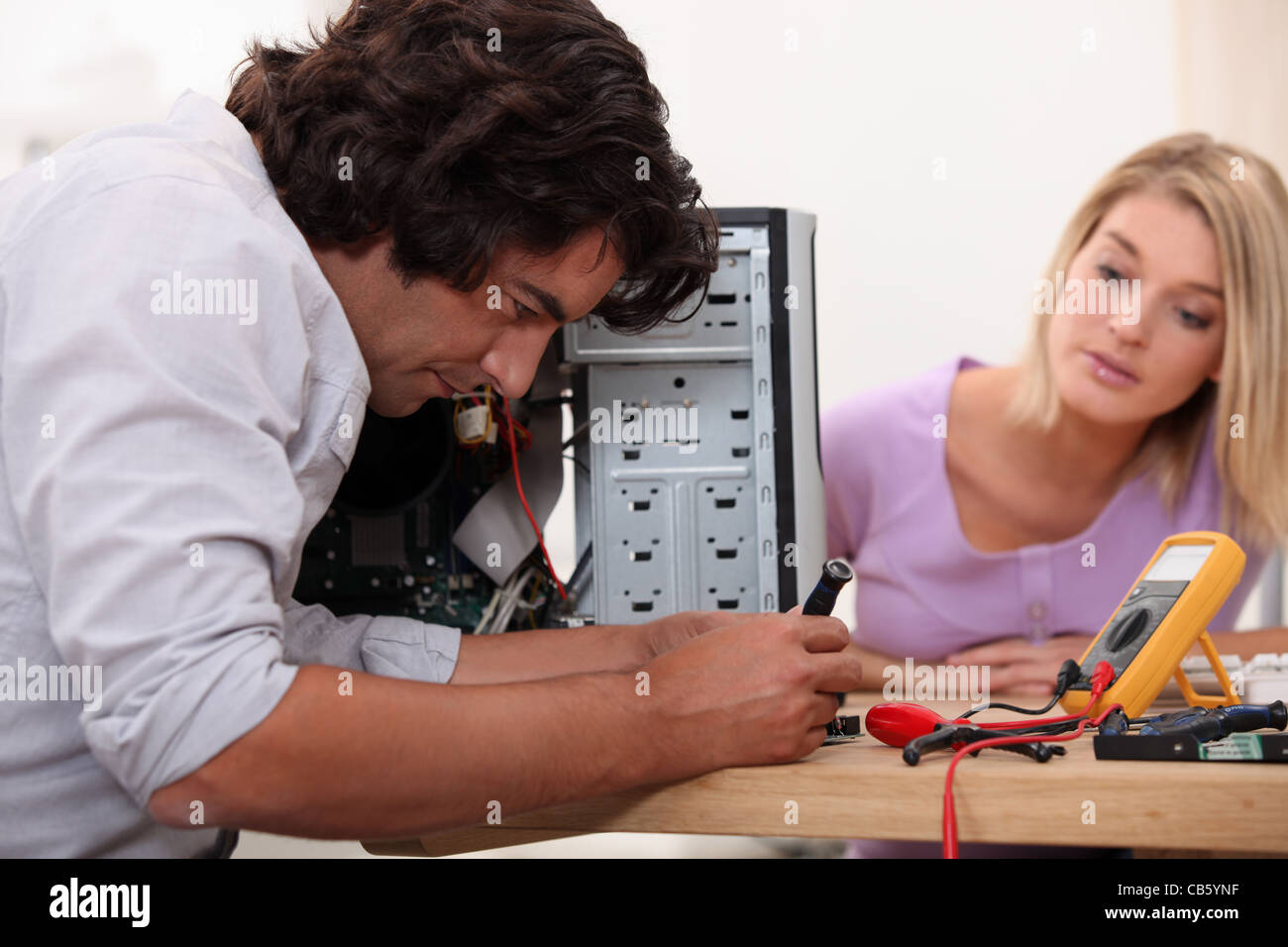 Man repairing his computer Stock Photo - Alamy