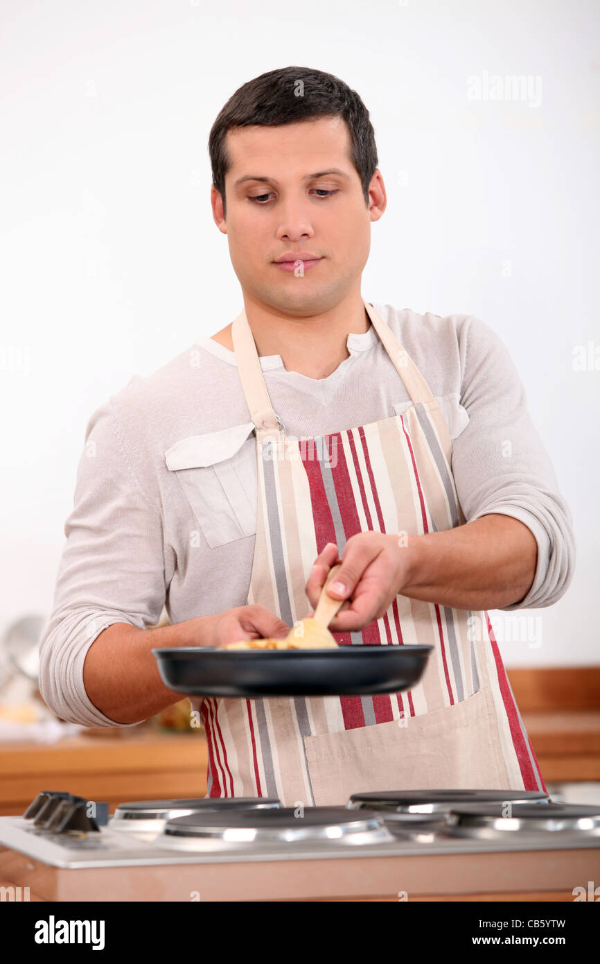 young man cooking Stock Photo - Alamy