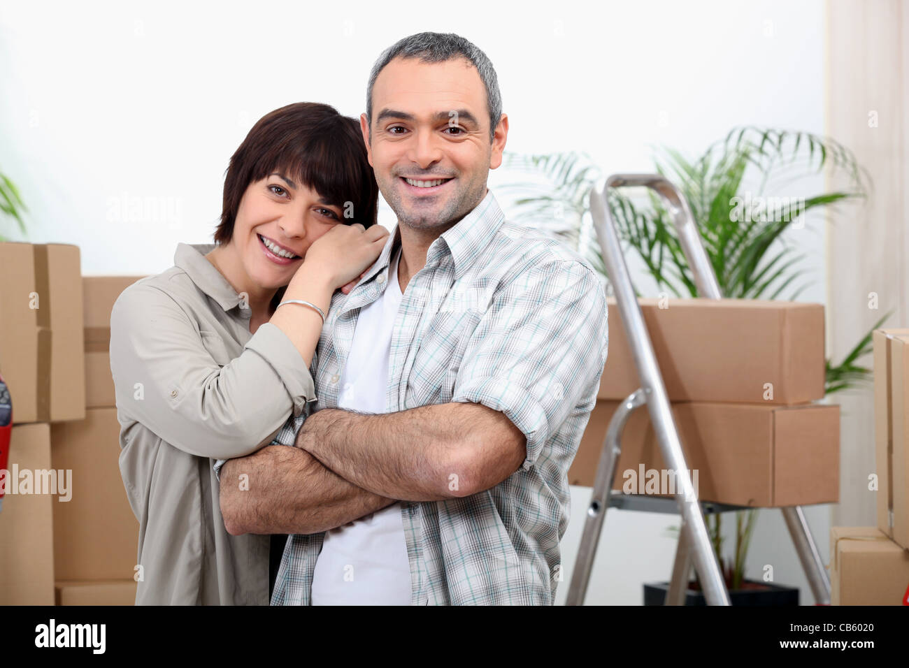 Couple moving house Stock Photo - Alamy