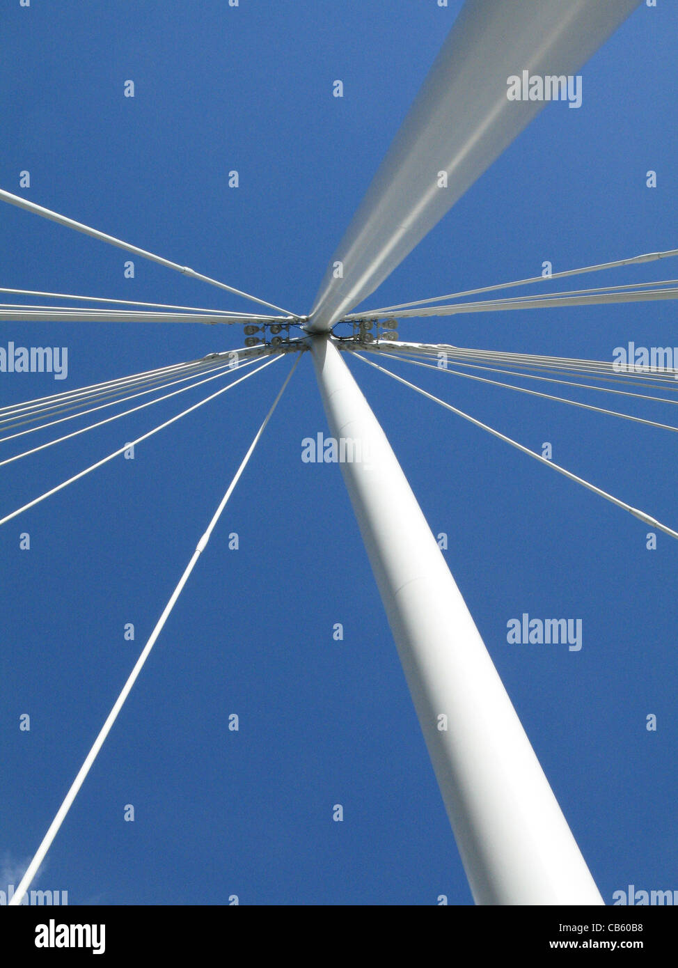 Bridge support poles and tension cables against a bright blue sky Stock ...