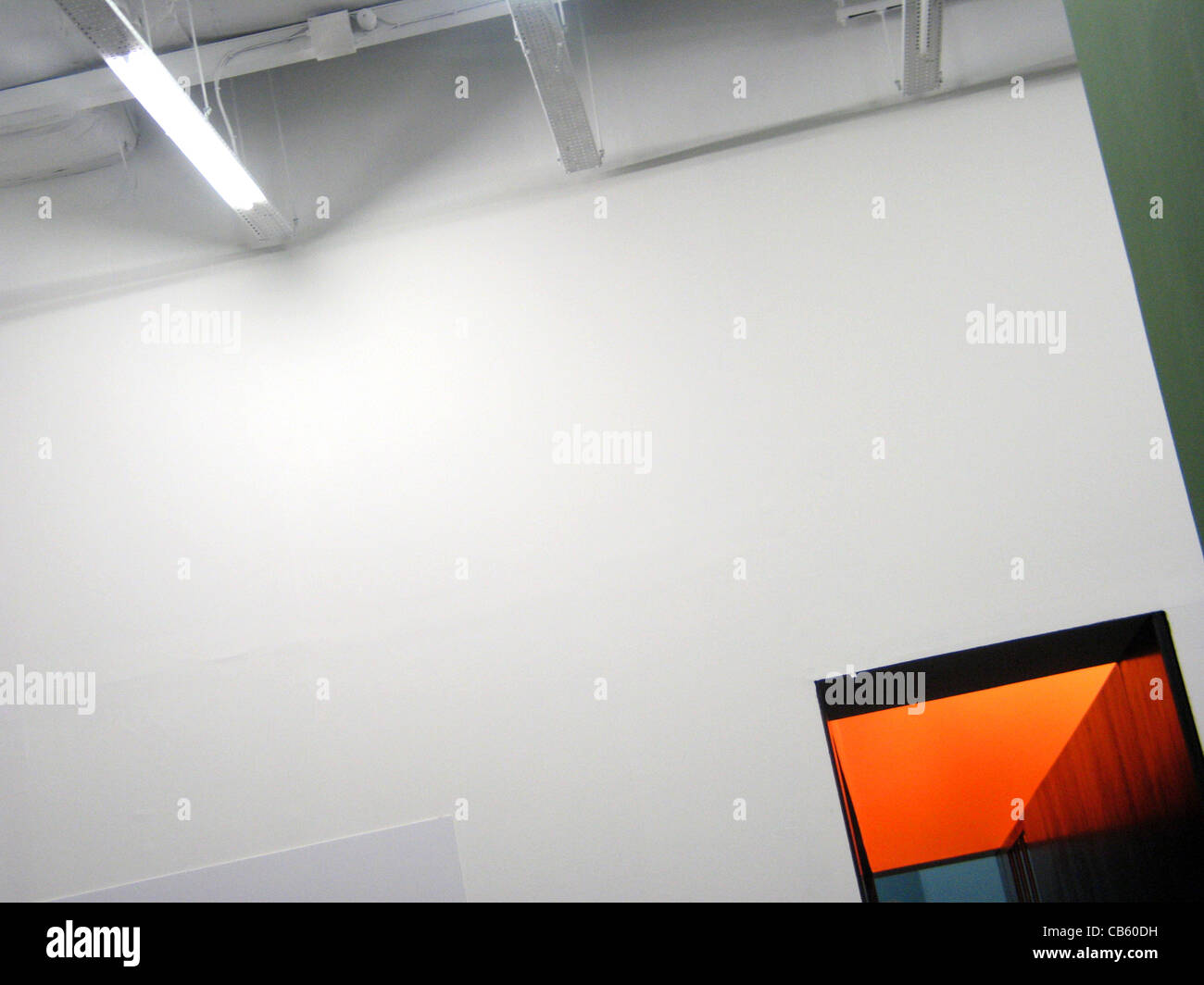 Gallery interior wall with strip light and corridor Stock Photo - Alamy