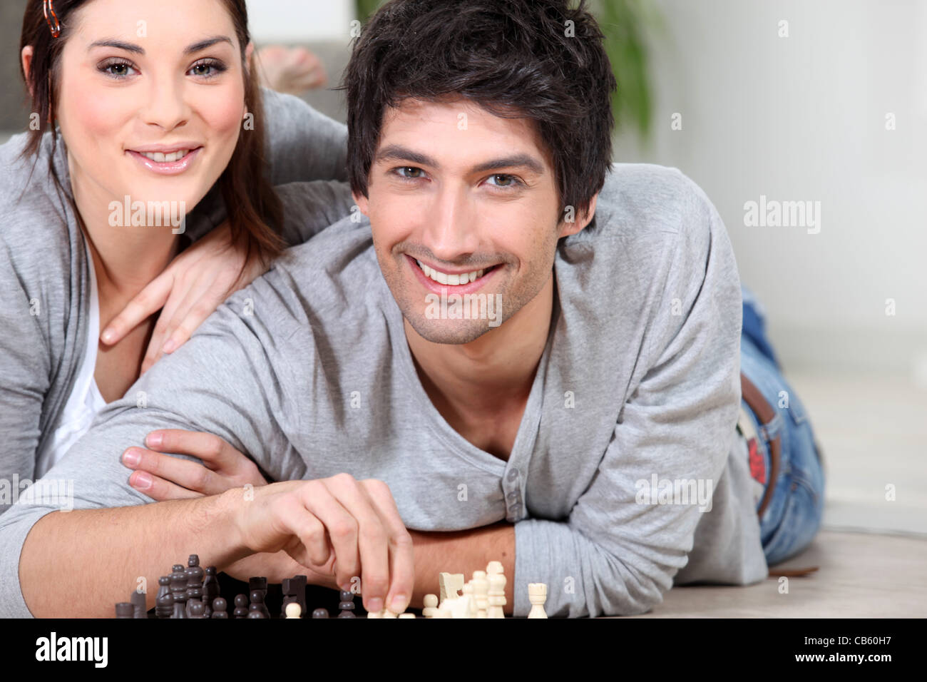 Couple playing chess Stock Photo - Alamy