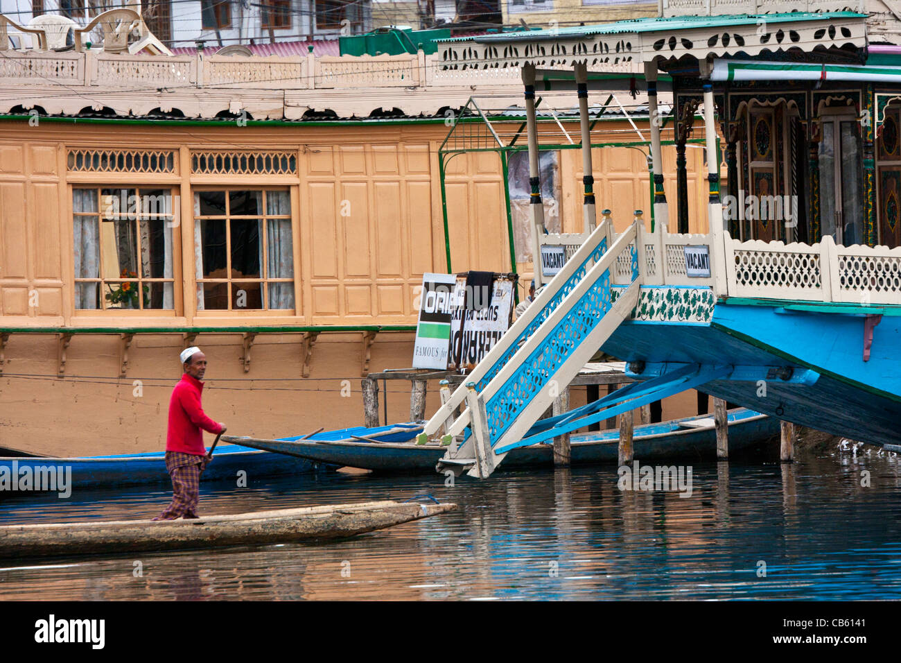 A man rows through Dal lake, Kashmir Stock Photo - Alamy